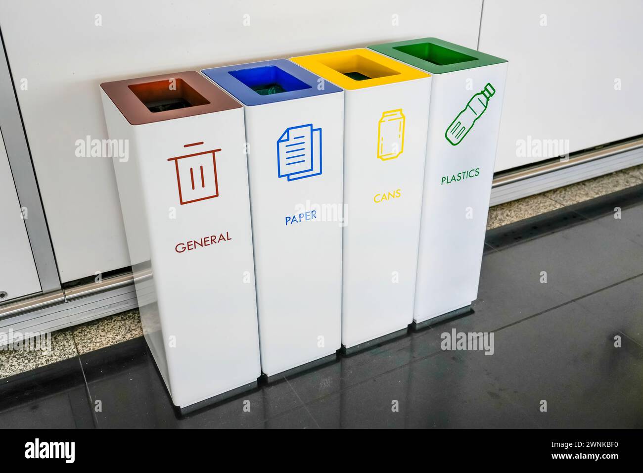 Four colorful recycle bins general paper cans plastic Stock Photo - Alamy