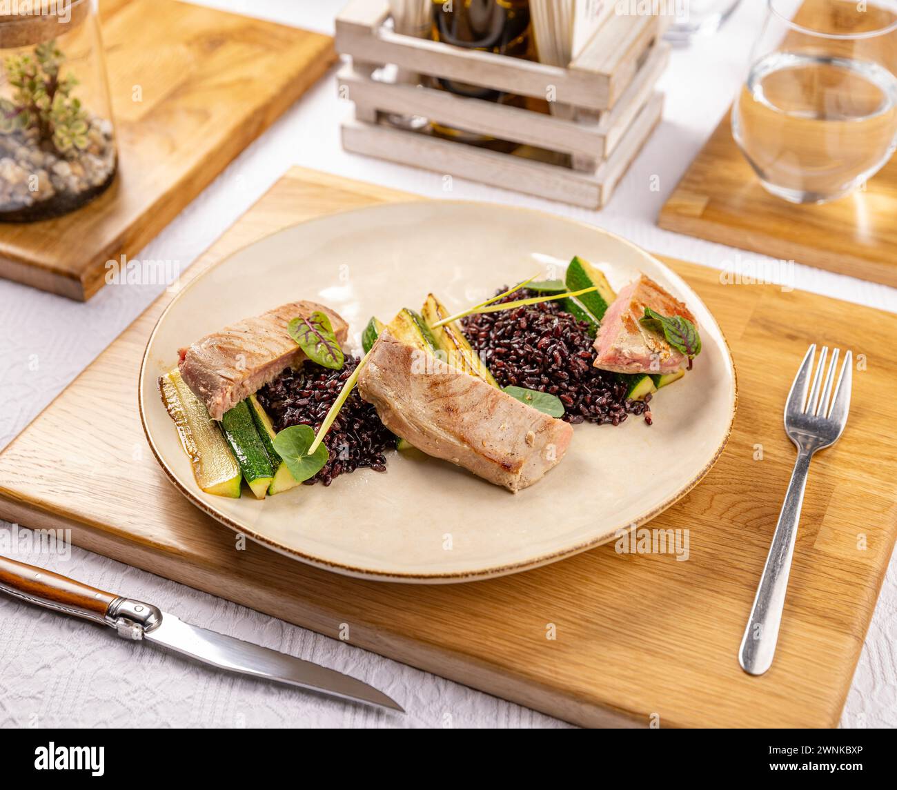 Roasted fish fillet served with wild rice and grilled zucchini Stock ...