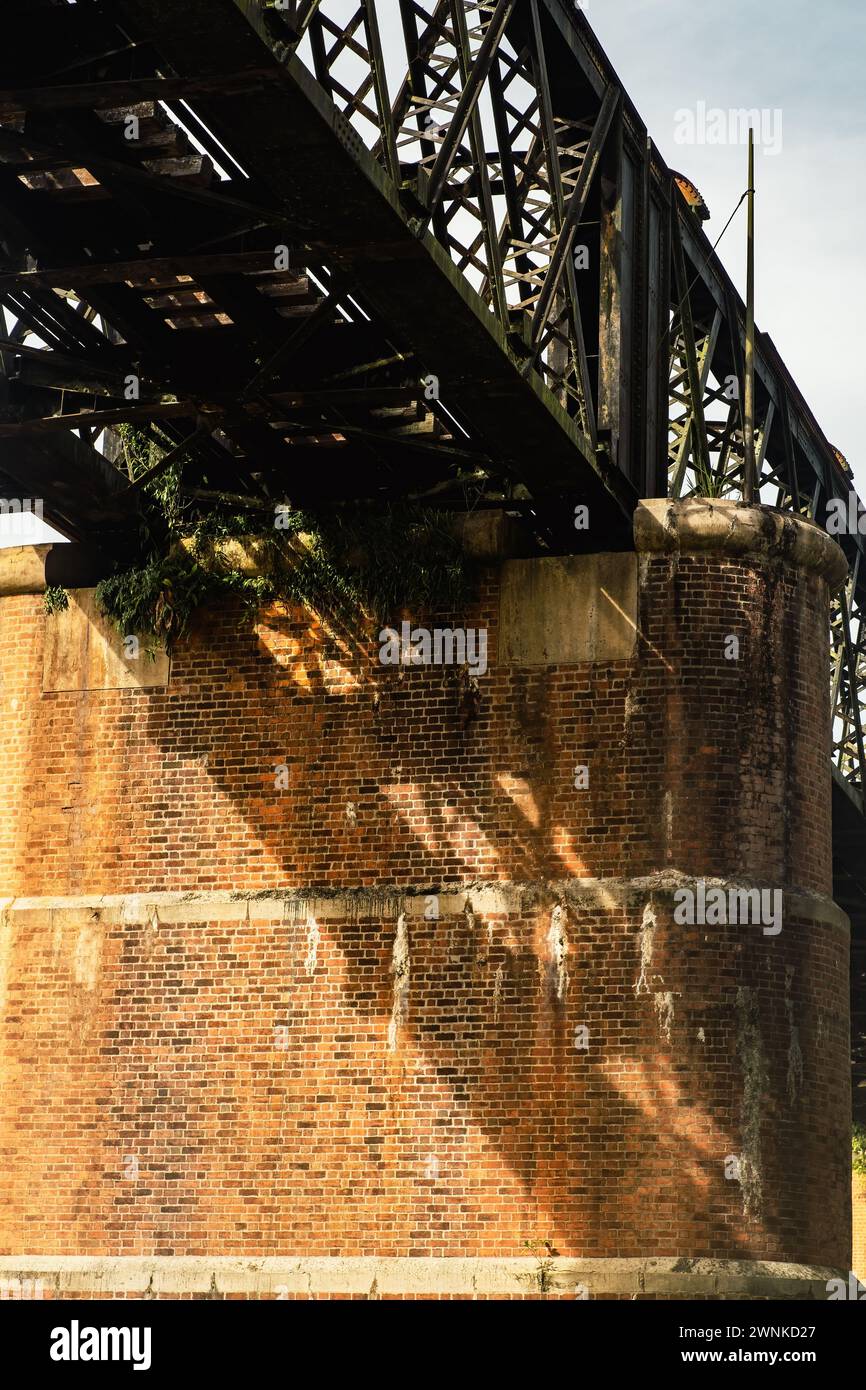A large brick and stone masonry arch bridge over the Kuala Kangsar ...