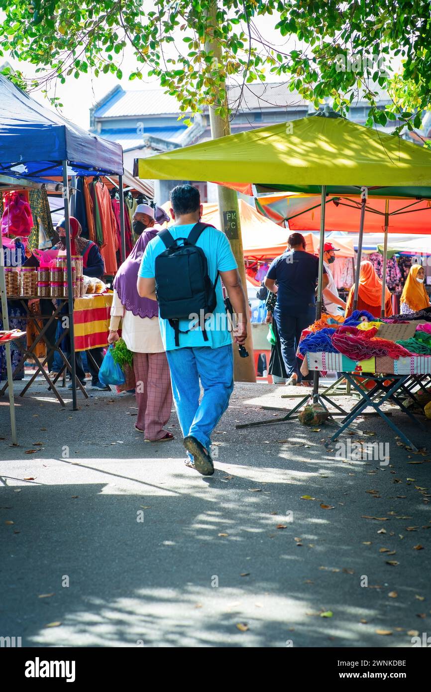 PERAK, MALAYSIA - Oct 18, 2022: A man walking at morning market in ...
