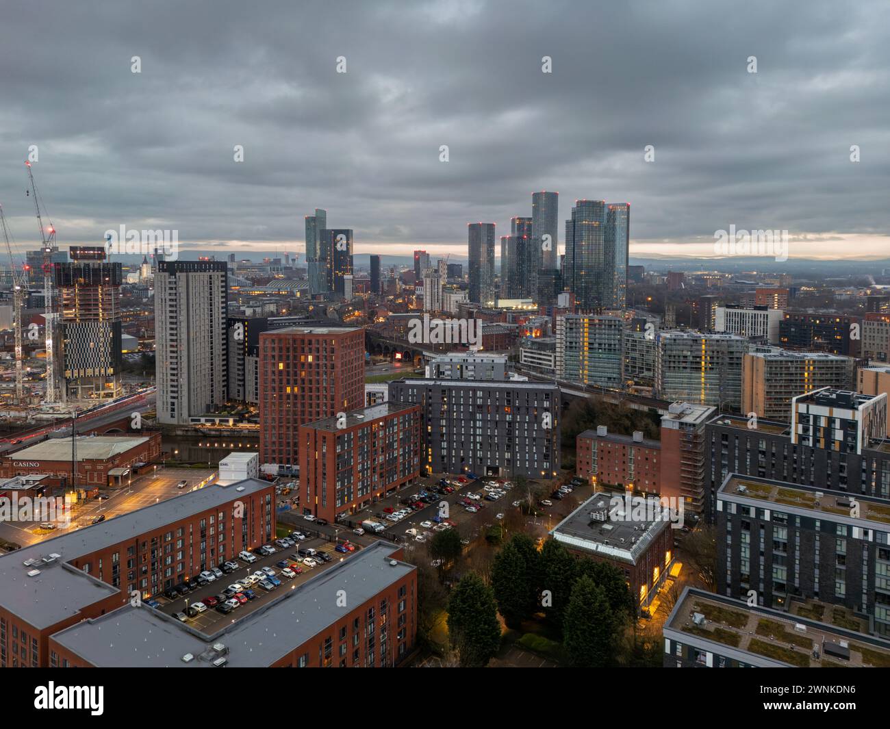 Aerial drone shot across Manchester shot from the west looking east at ...