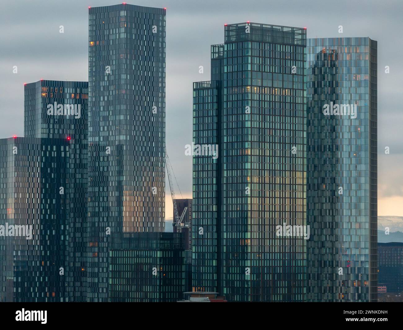 Aerial drone shot across Manchester shot from the west looking east at ...