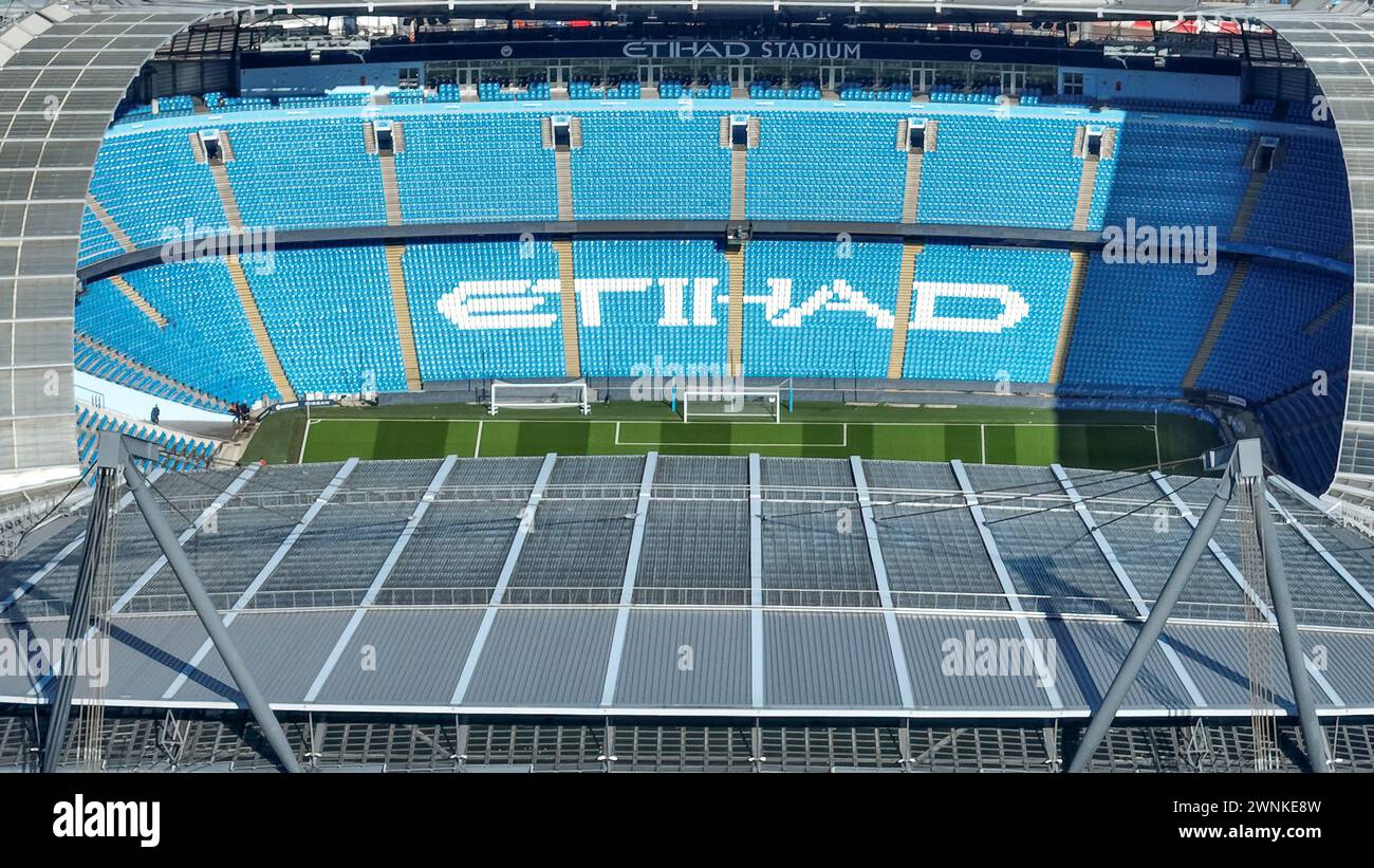 White Etihad logo is embedded in the seating at the Etihad Stadium ...