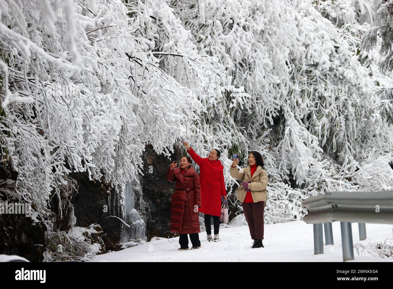 CHONGQING, CHINA - MARCH 2, 2024 - Tourists enjoy the snow scenery at ...