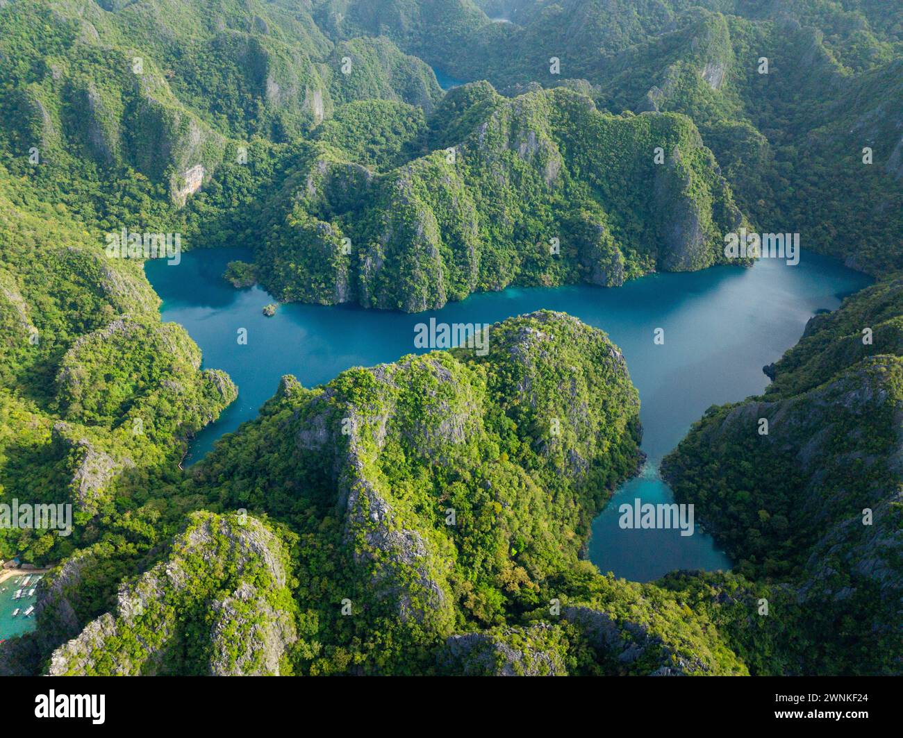 Tropical landscape of mountain lake with limestone rocks. Kayangan Lake ...
