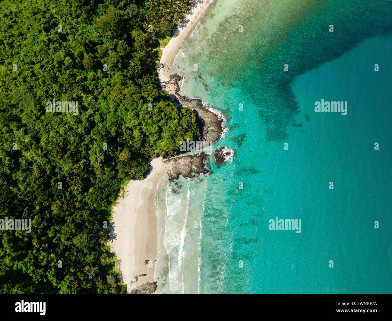 Tropical beach with waves over the sands. Turquoise clear sea water. El ...