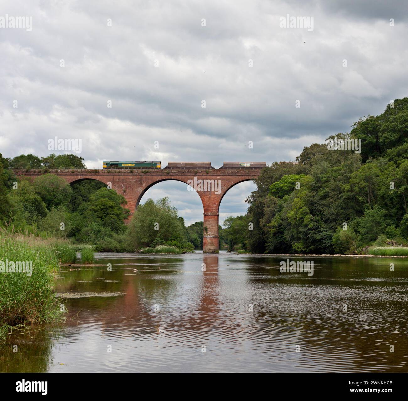Freightliner class 66 locomotive crossing the river Eden at Wetheral ...