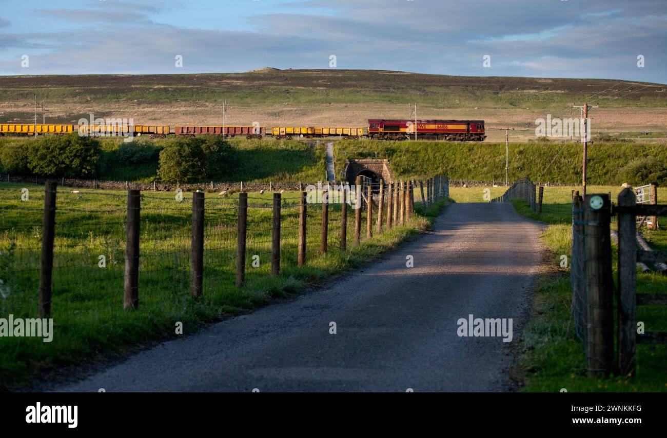 EWS class 66 locomotive 66186 hauling train carrying materials for ...