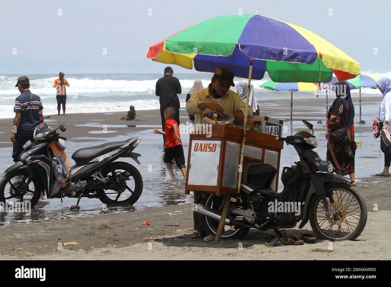 Bantul, Yogyakarta, Indonesia. 3rd Mar, 2024. A street vendor waits for ...