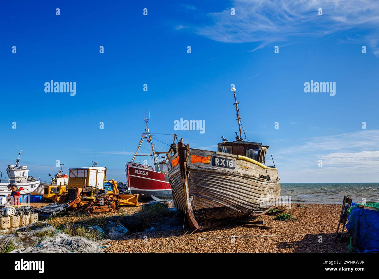 Beached traditional small wooden fishing boats on the beach at Hastings ...