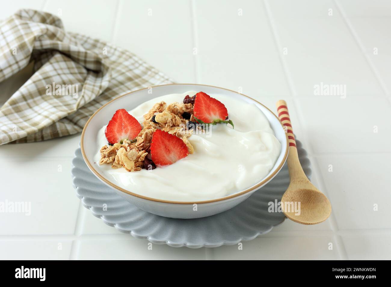 Greek Yoghurt with Strawberry and Granola Topping Stock Photo - Alamy