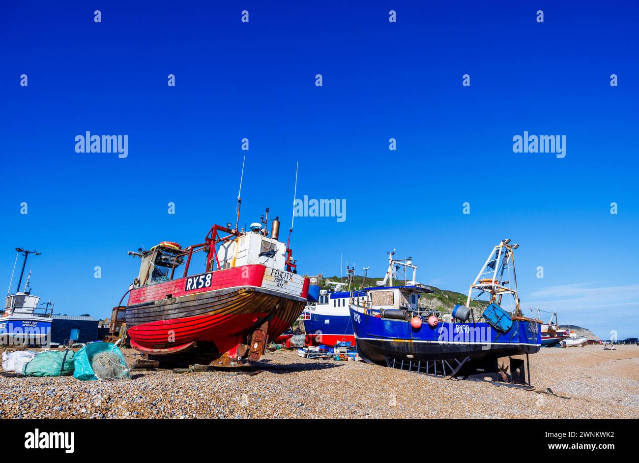 Colourful beached traditional small wooden fishing boat 'Felicity' and ...