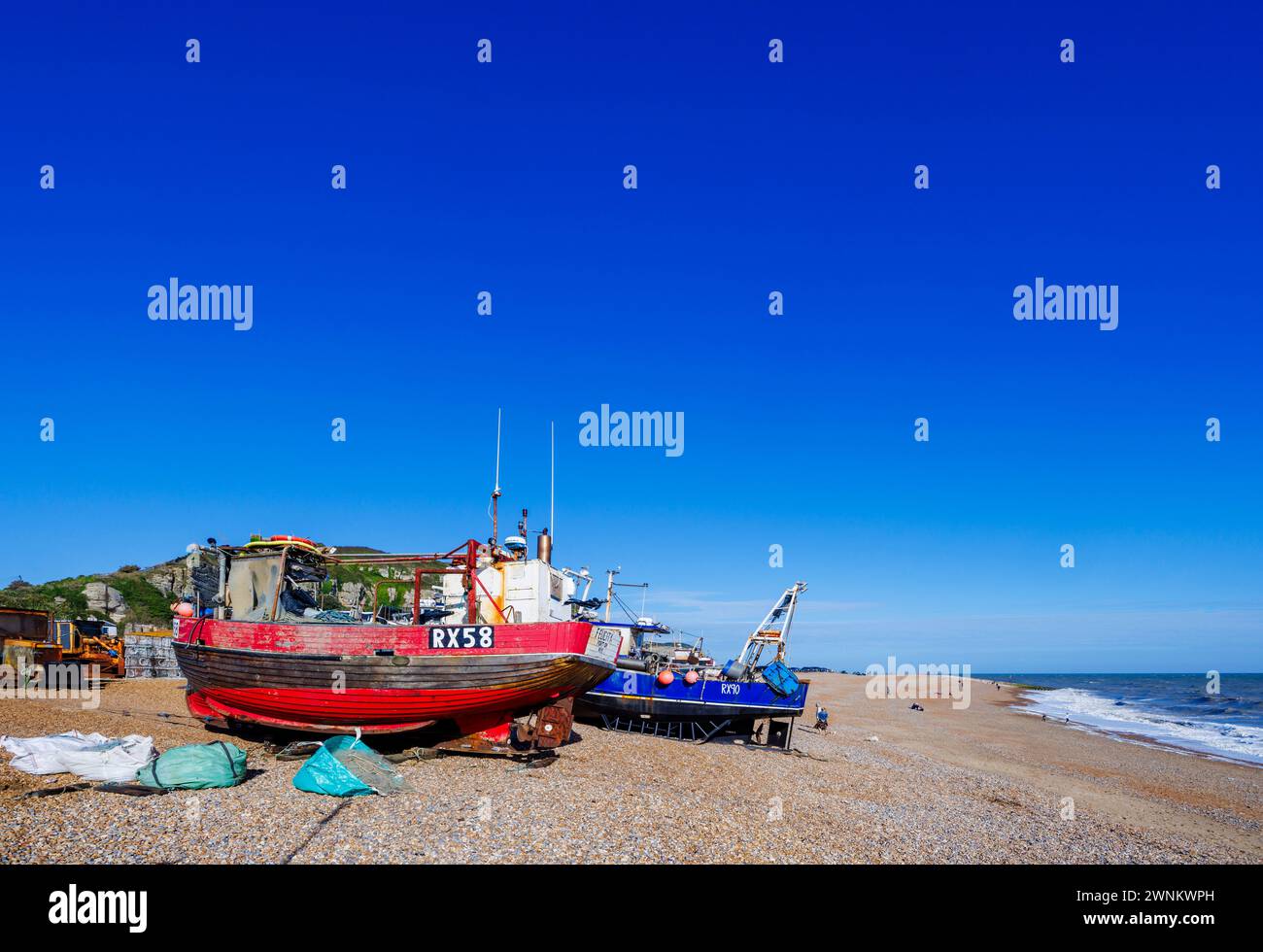 Colourful beached small wooden fishing boats of the Hastings Land Based ...