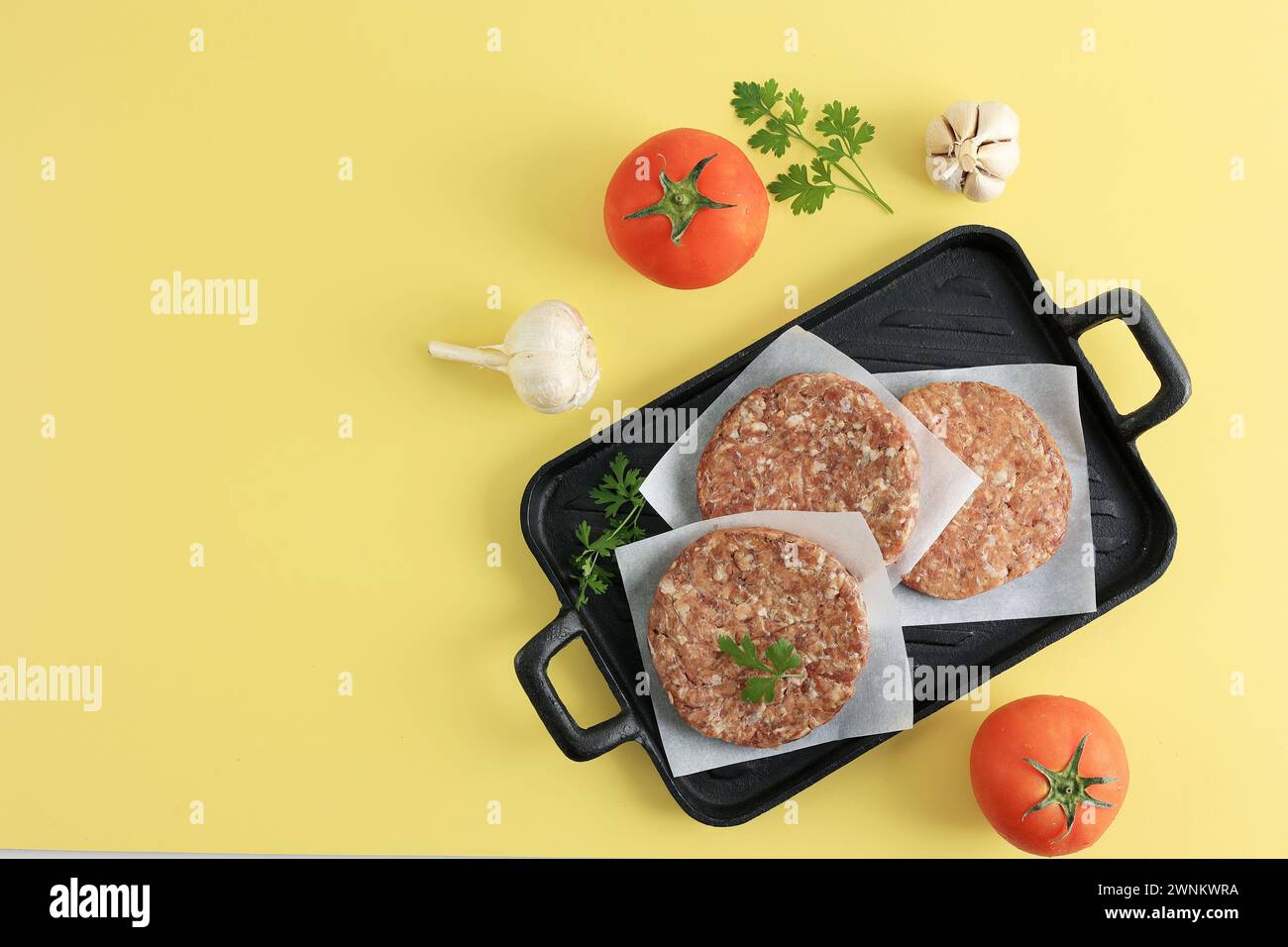 Raw Ground Beef Burger Steak Patties on Yellow Table. Top View Stock ...