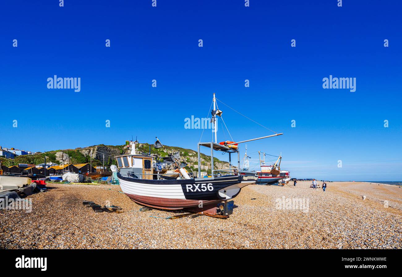 Beached traditional small wooden fishing boats hauled up on the shingle ...
