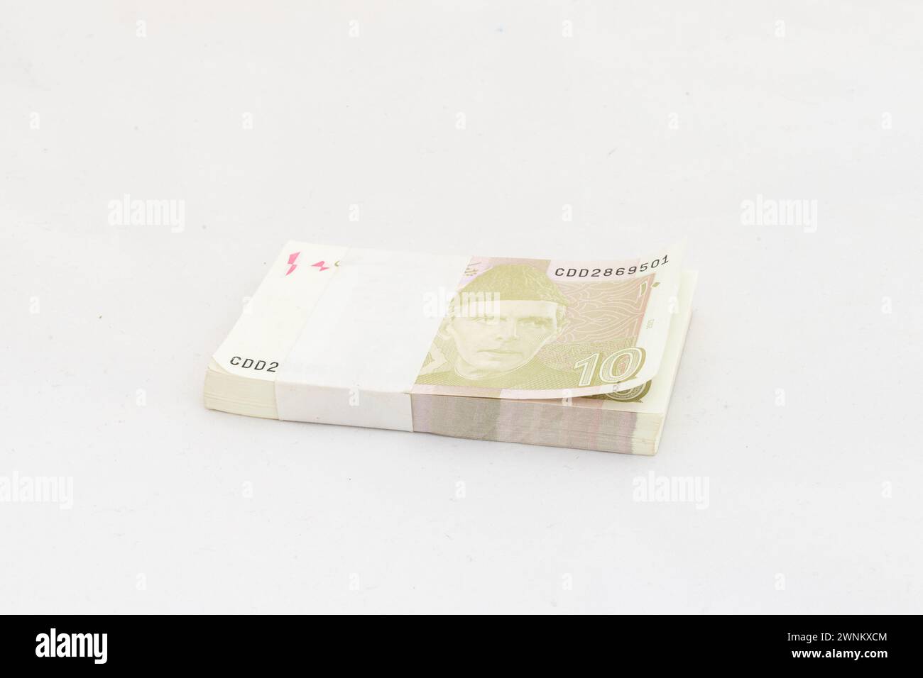 Pakistan ten rupees denomination note bundle on white isolated ...