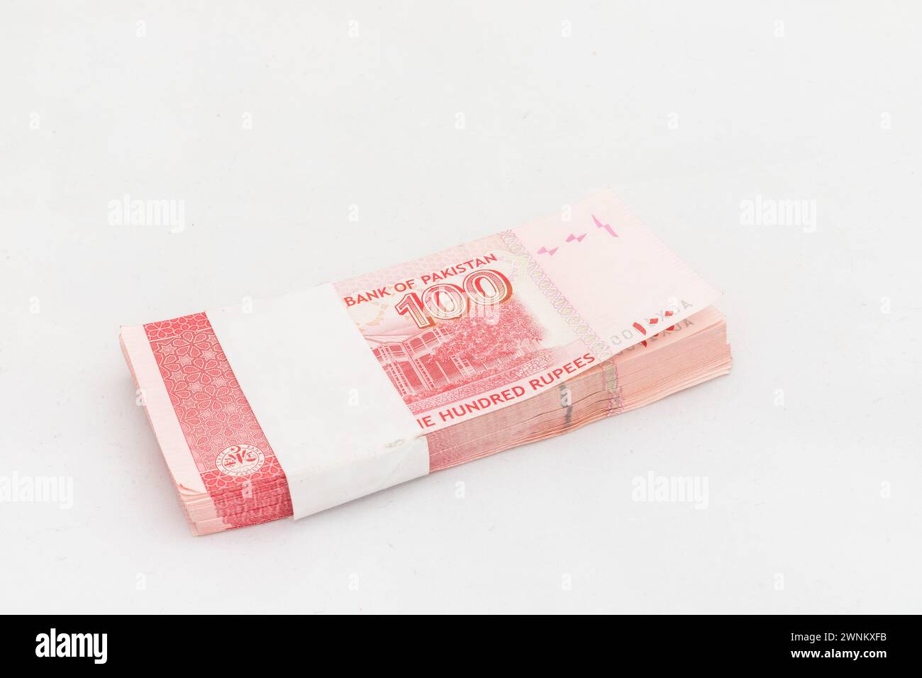 Pakistan one hundred rupees denomination note bundle on white isolated ...
