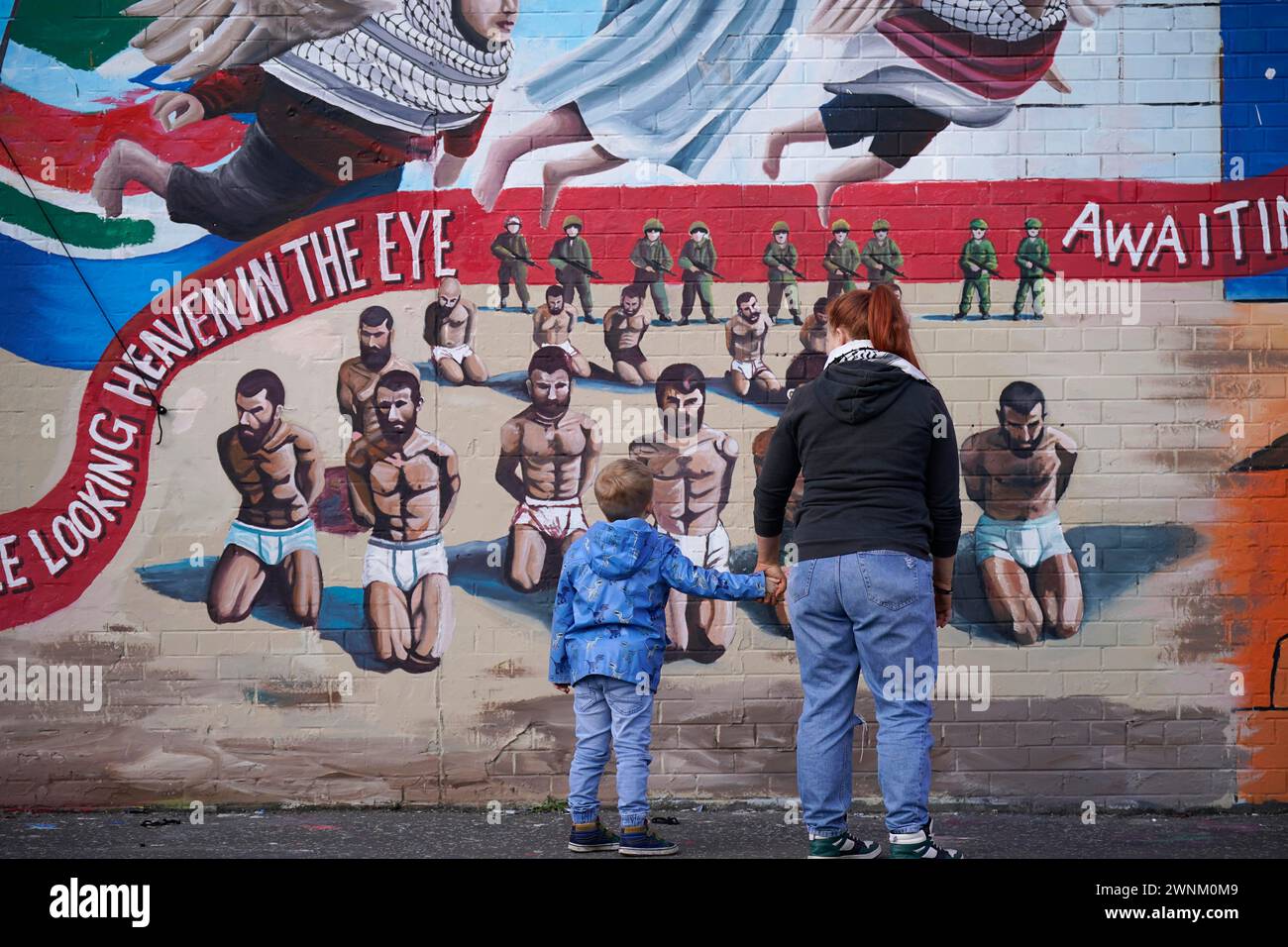 People at the unveiling of the International Wall in Belfast after it ...
