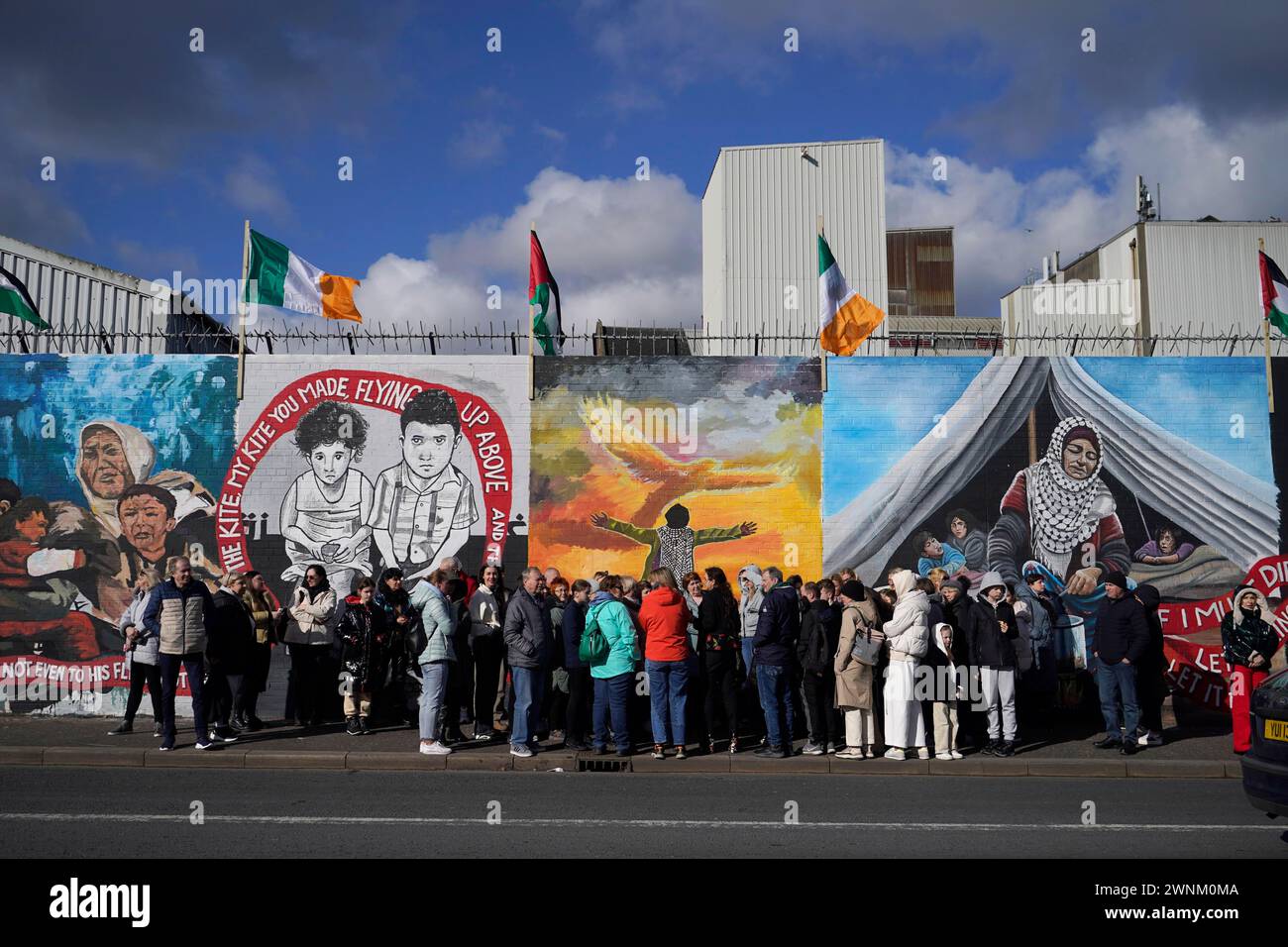 People at the unveiling of the International Wall in Belfast after it ...