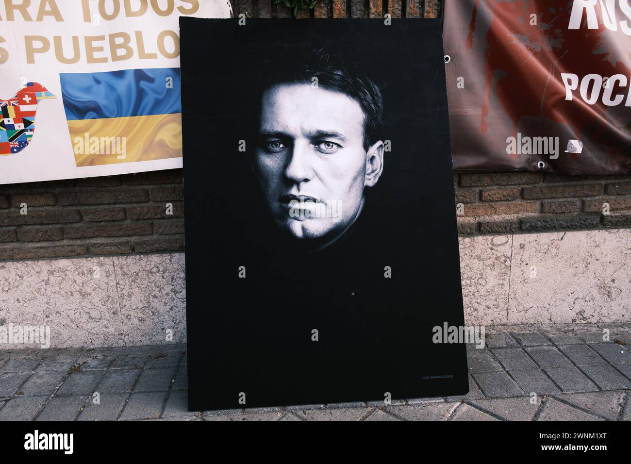 Several people take part in a tribute to Alexei Navalni, in front of ...