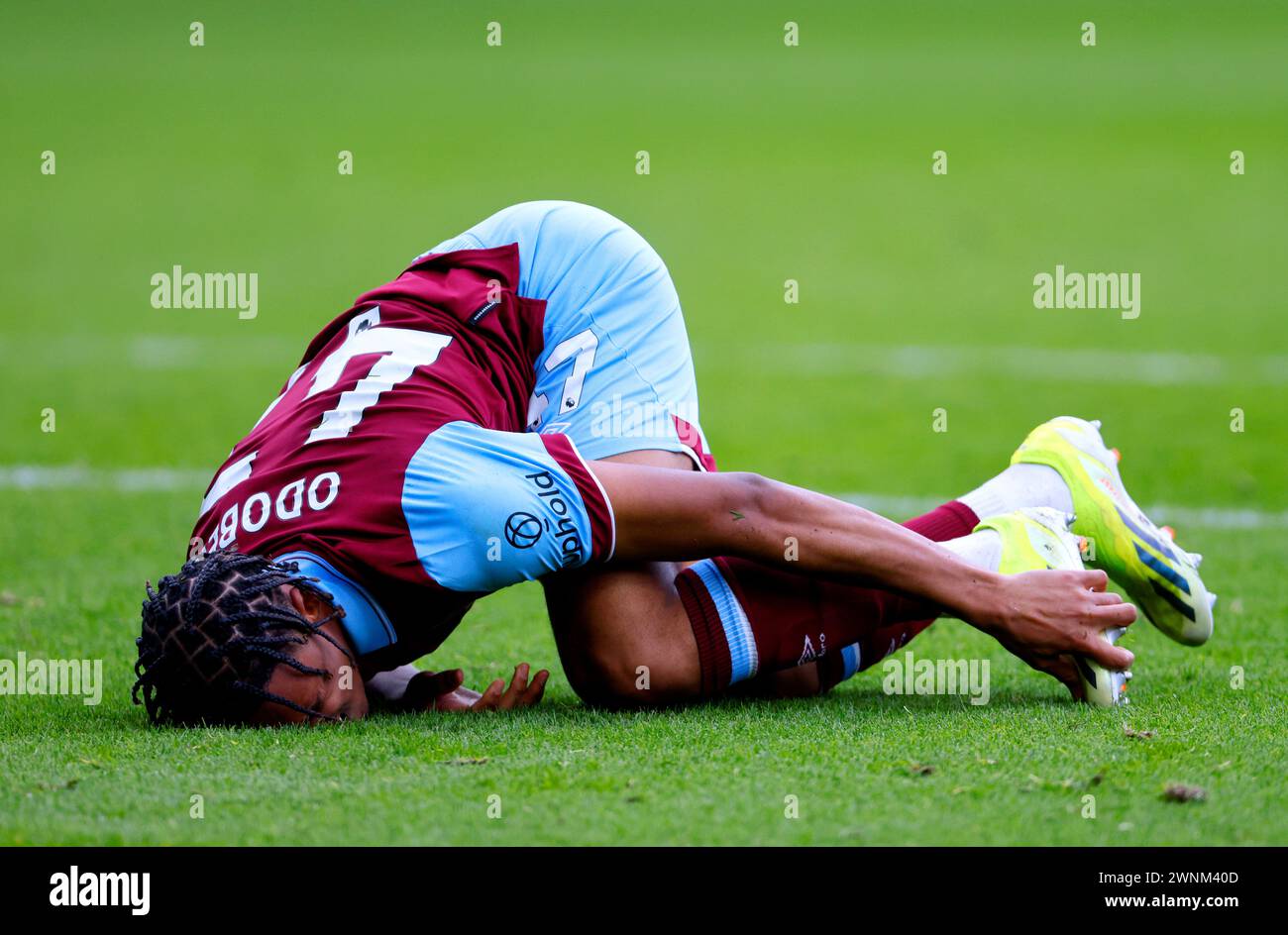 Burnley's Wilson Odobert goes down injured during the Premier League ...