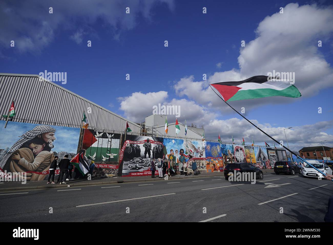 People at the unveiling of the International Wall in Belfast after it ...