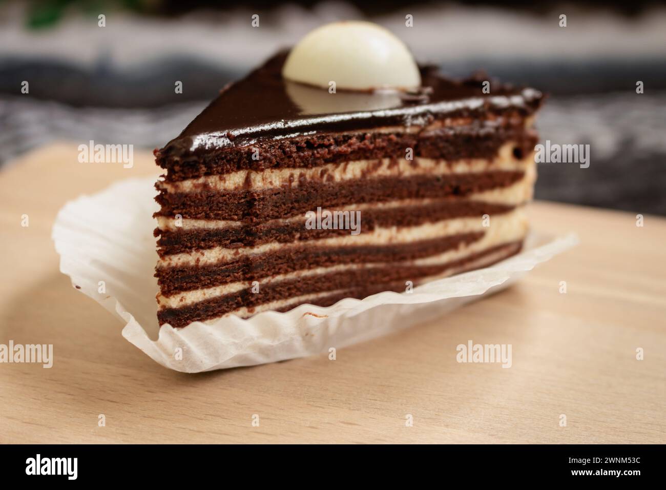 Chocolate layer cake. Biscuit cake with melted ganache on top. Slice of ...