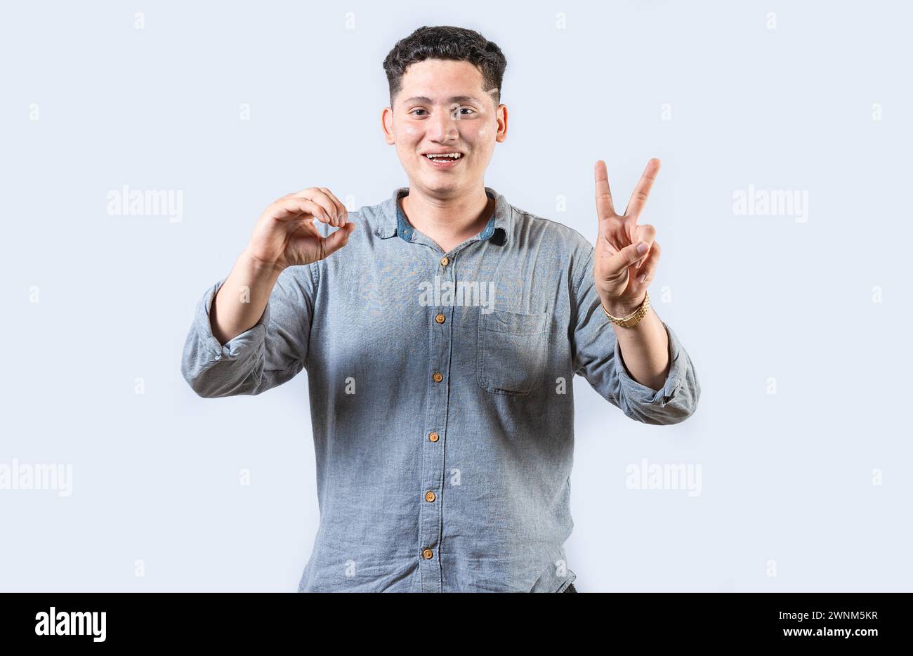 Man making peace sign hi-res stock photography and images - Alamy