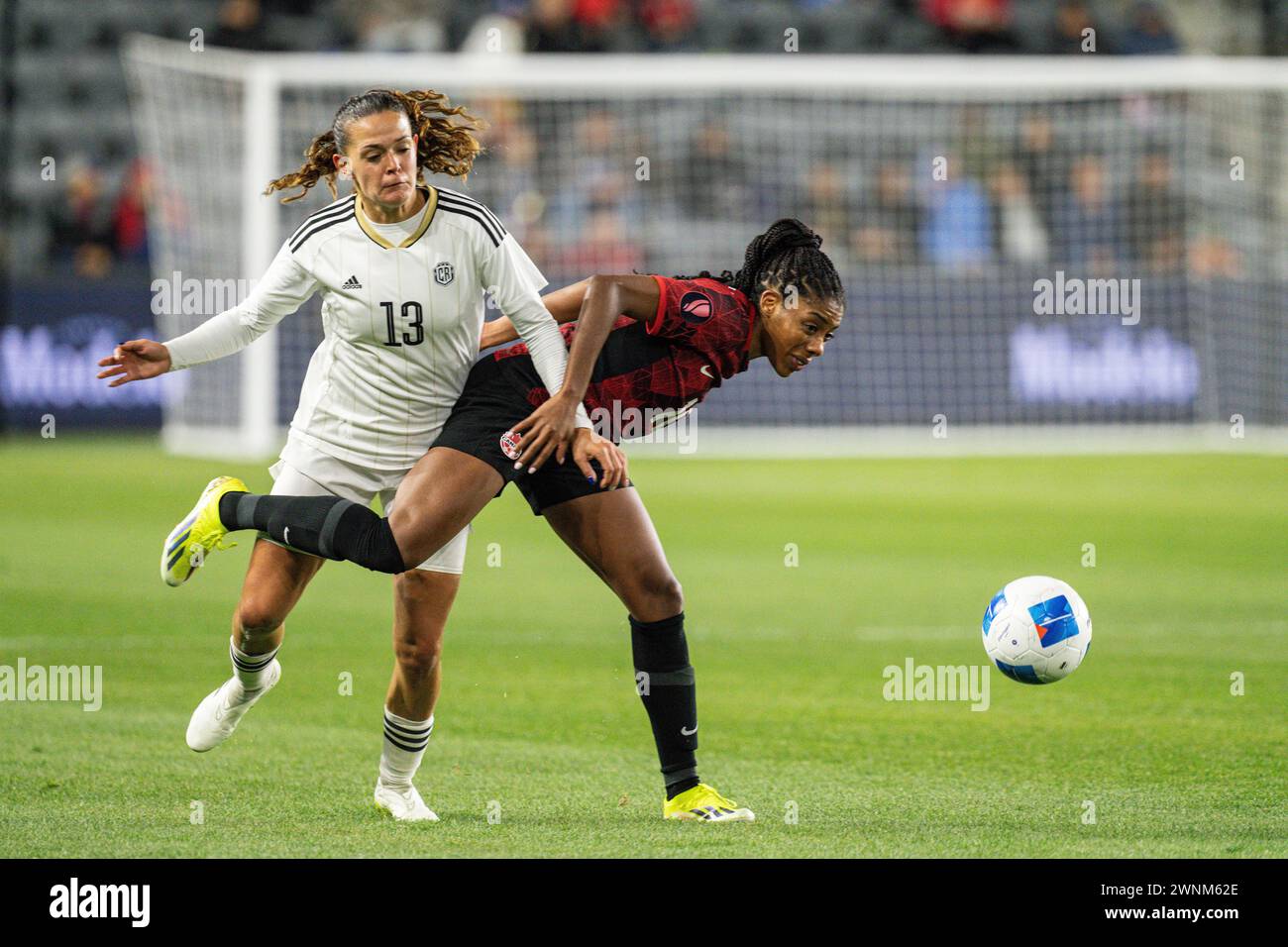 Costa Rica midfielder Emilie Valenciano (13) and Canada defender Ashley ...
