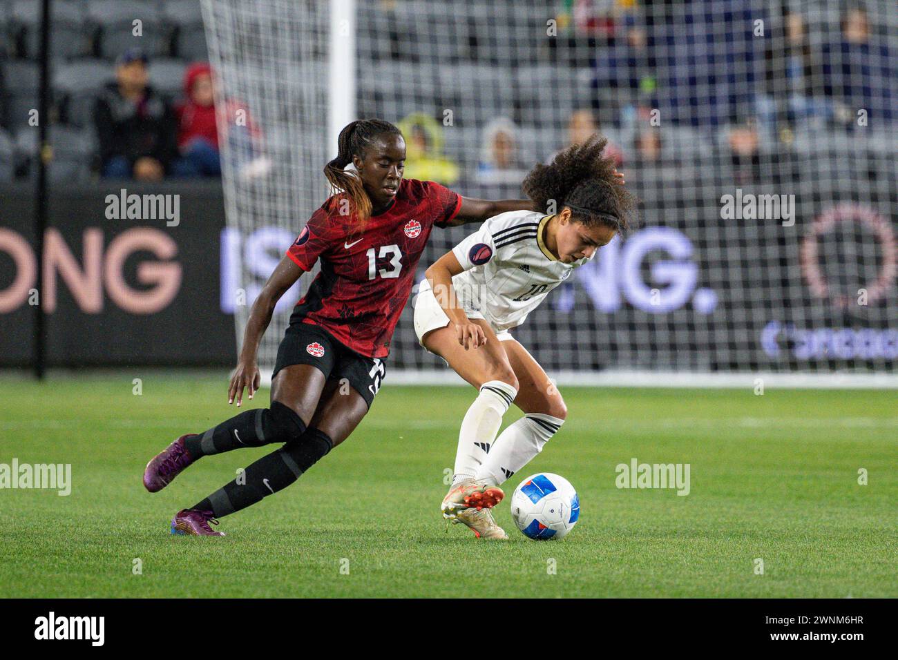 Costa Rica midfielder Alexandra Pinell (19) is defended by Canada ...