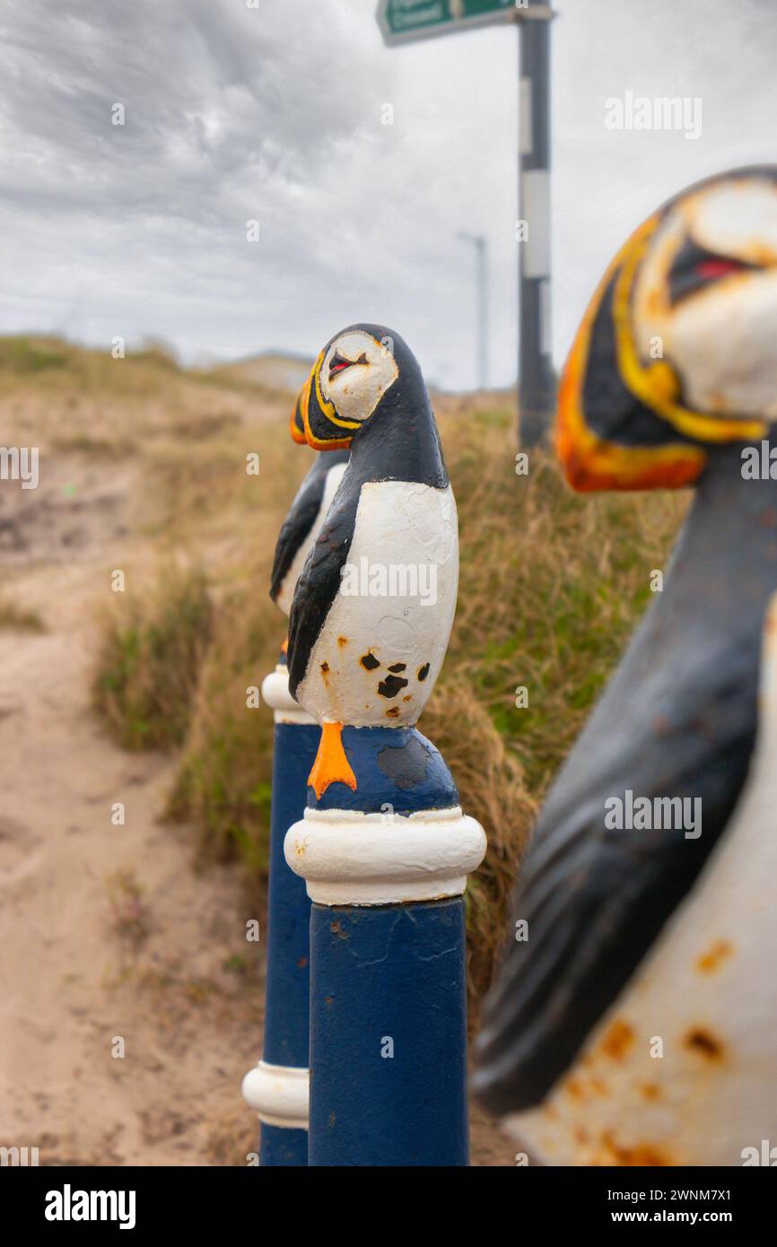 cast metal bollard in shape of painted puffins at Newbiggin by sea ...