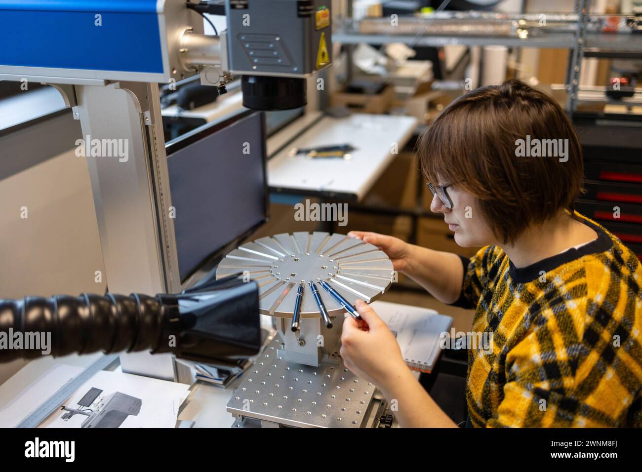 Woman operating a machine hi-res stock photography and images - Alamy