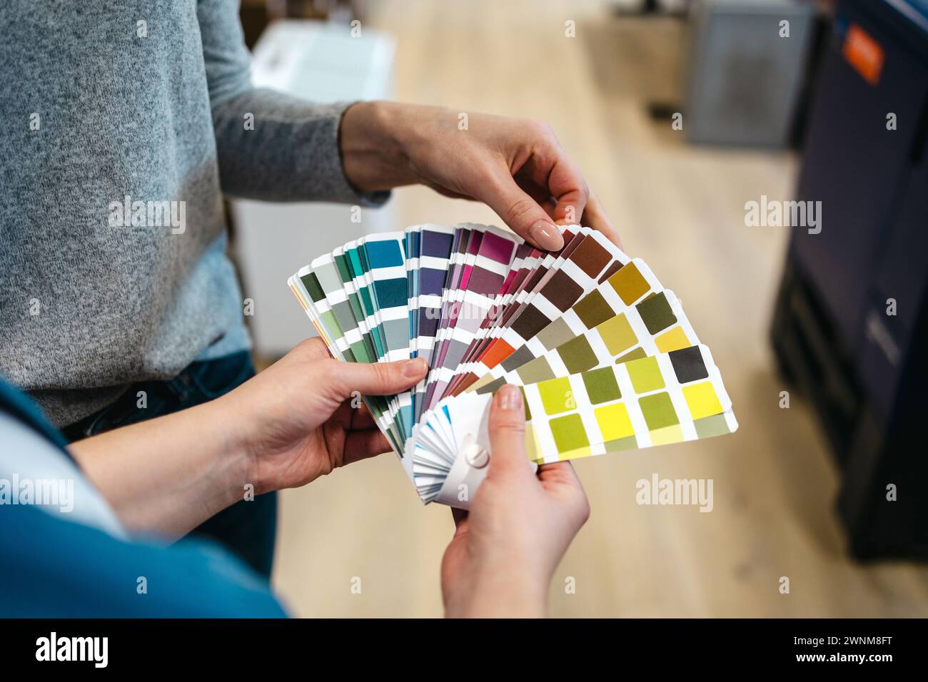 Woman hands with color samples at printing press Stock Photo - Alamy