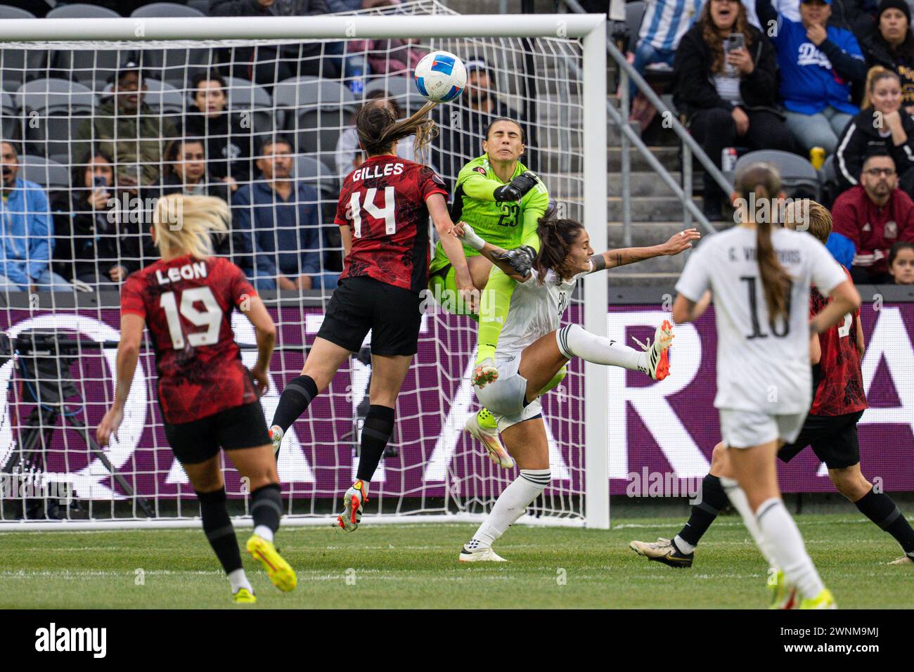 Costa Rica goalkeeper Daniela Solera (23) attempts to punch our a ...