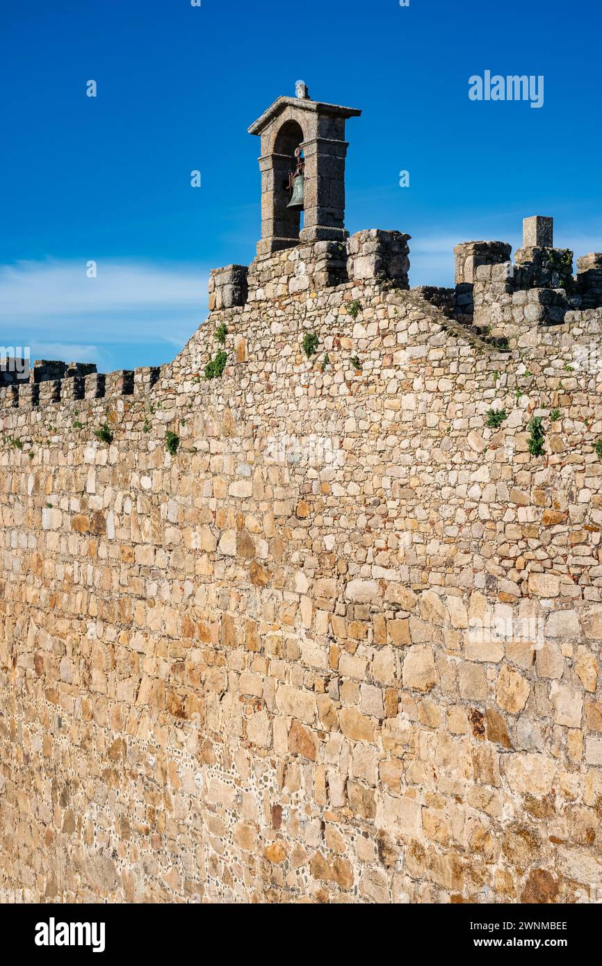 Great medieval stone wall with bell tower at the top of the building ...