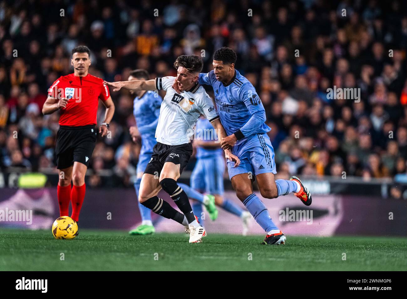 Jose Luis Pepelu of Valencia and Jude Bellingham of Real Madrid during ...