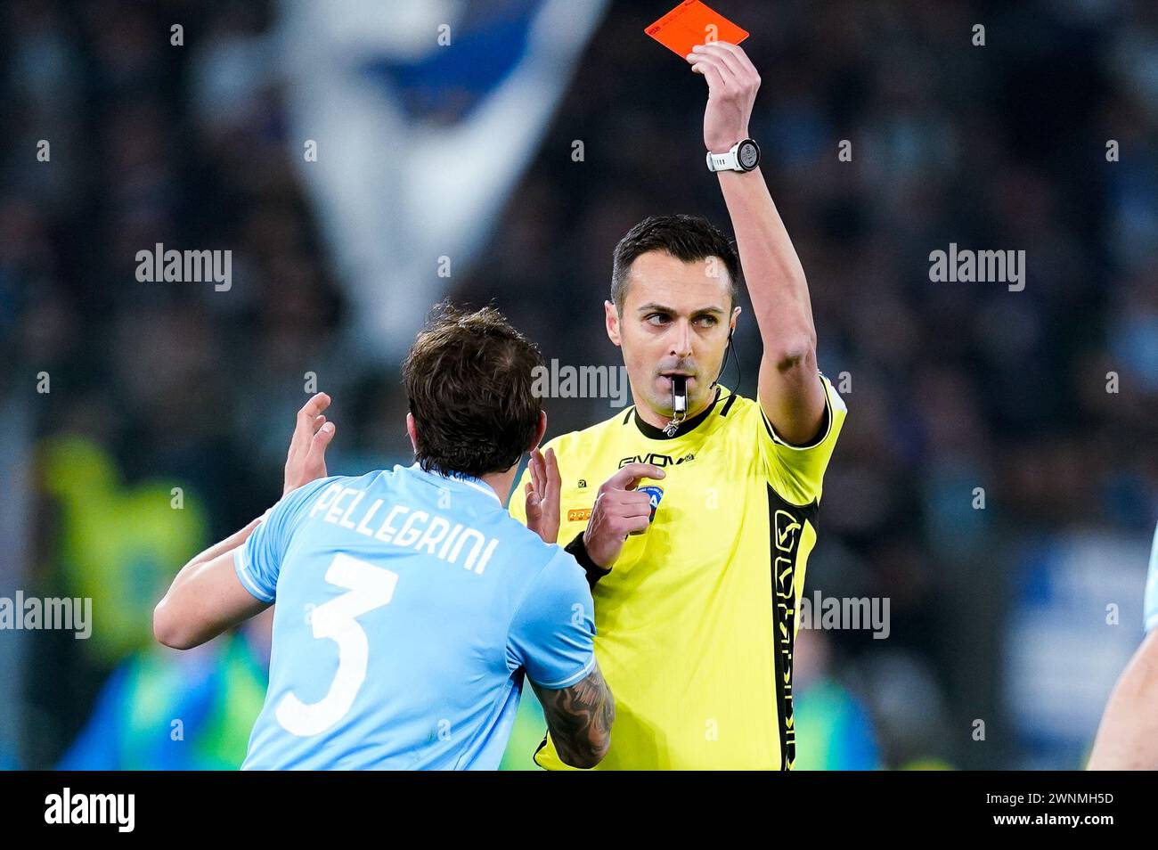 Rome, Italy. 01st Mar, 2024. Referee Marco Di Bello shows a red card to Luca Pellegrini of SS ...