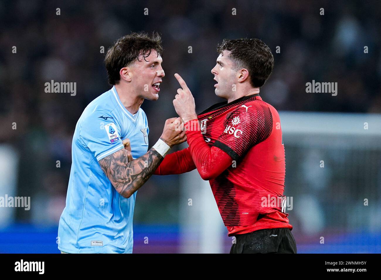 Rome, Italy. 01st Mar, 2024. Luca Pellegrini of SS Lazio argues with Christian Pulisic of AC ...