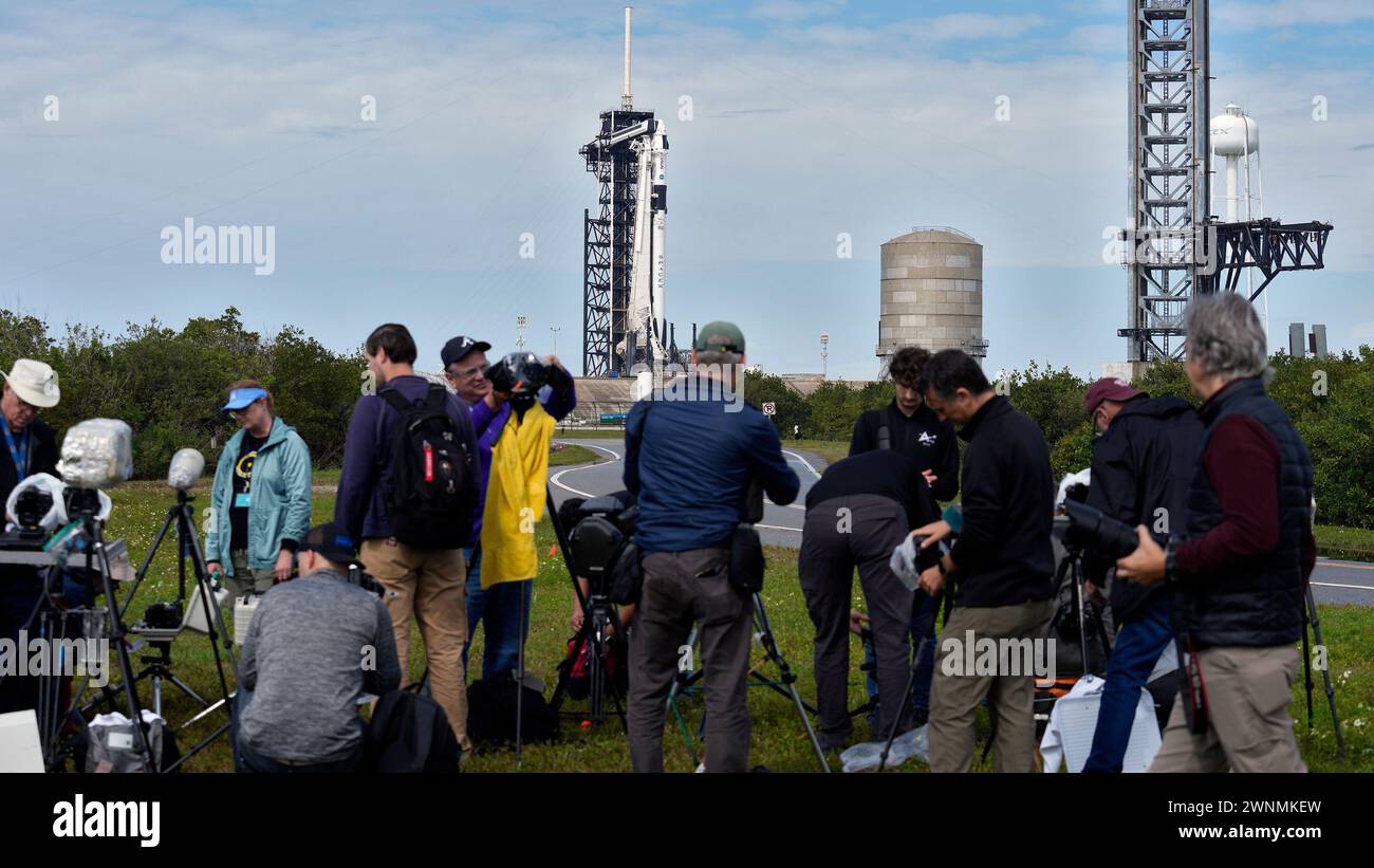 Photographers reset remote cameras as a SpaceX Falcon 9 rocket sits on ...
