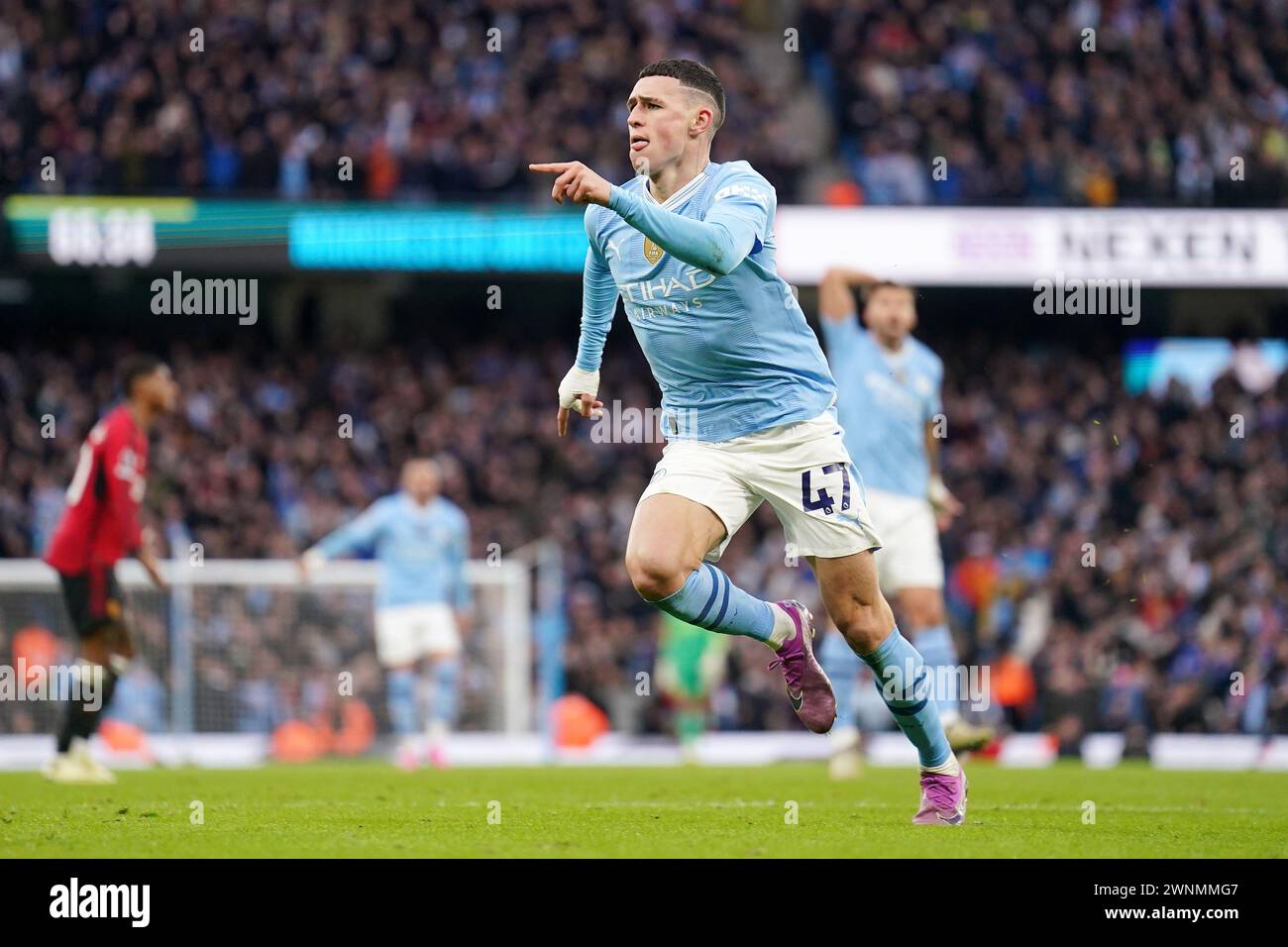 Manchester City's Phil Foden celebrates scoring their side's first goal ...