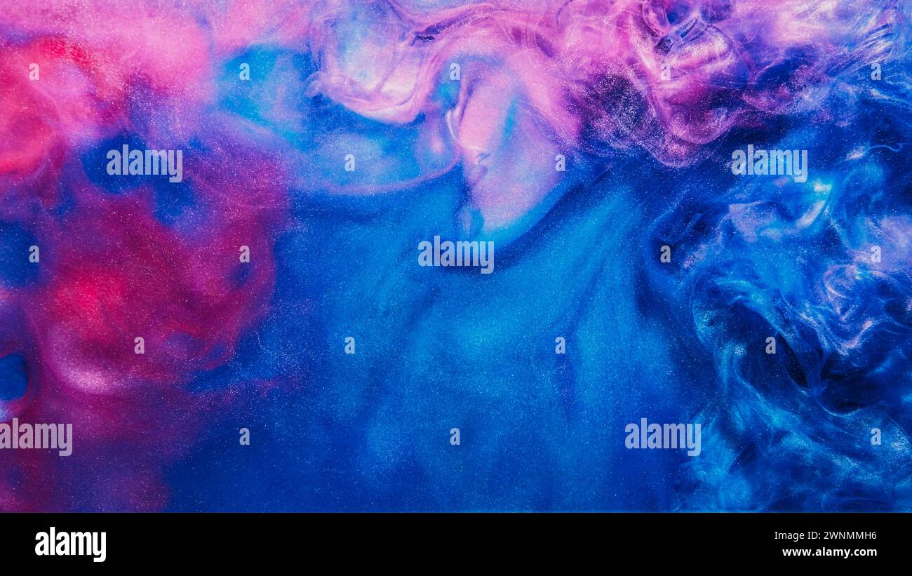 Ink water splash glitter paint blend pink blue mix Stock Photo - Alamy