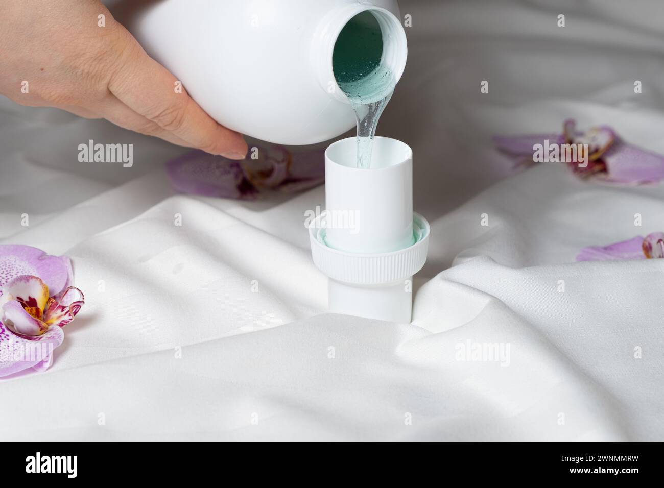 The process of pouring natural eco gel liquid laundry detergent from ...