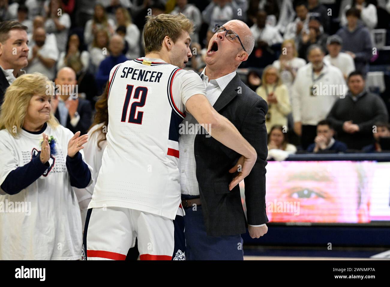 UConn guard Cam Spencer (12) is chest bumped by UConn head coach Dan ...