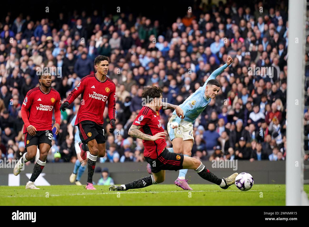 Manchester City's Phil Foden (right) scores their side's second goal of ...