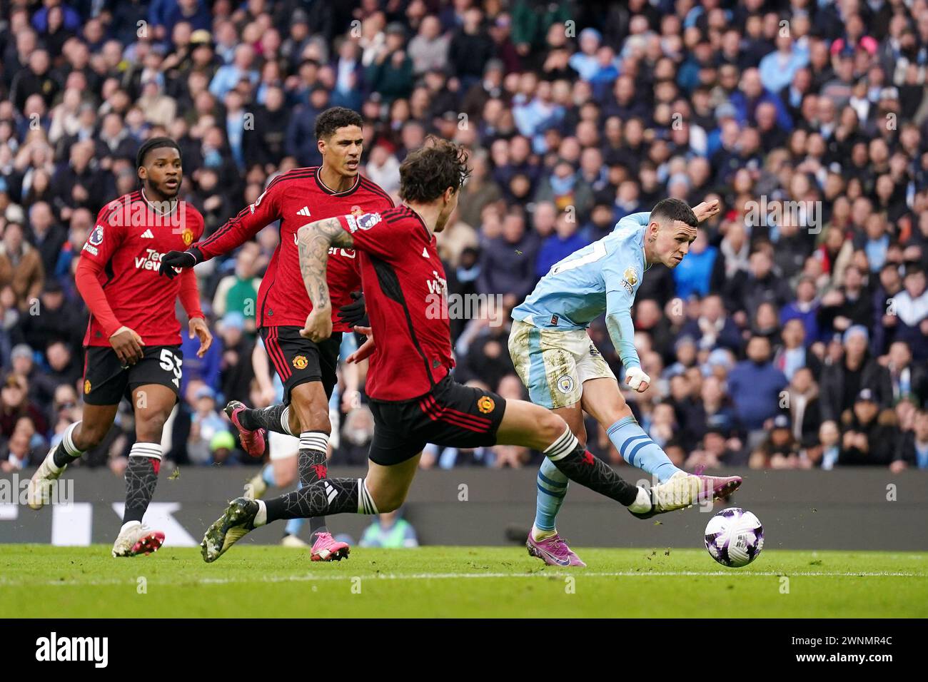 Manchester City's Phil Foden (right) scores their side's second goal of ...