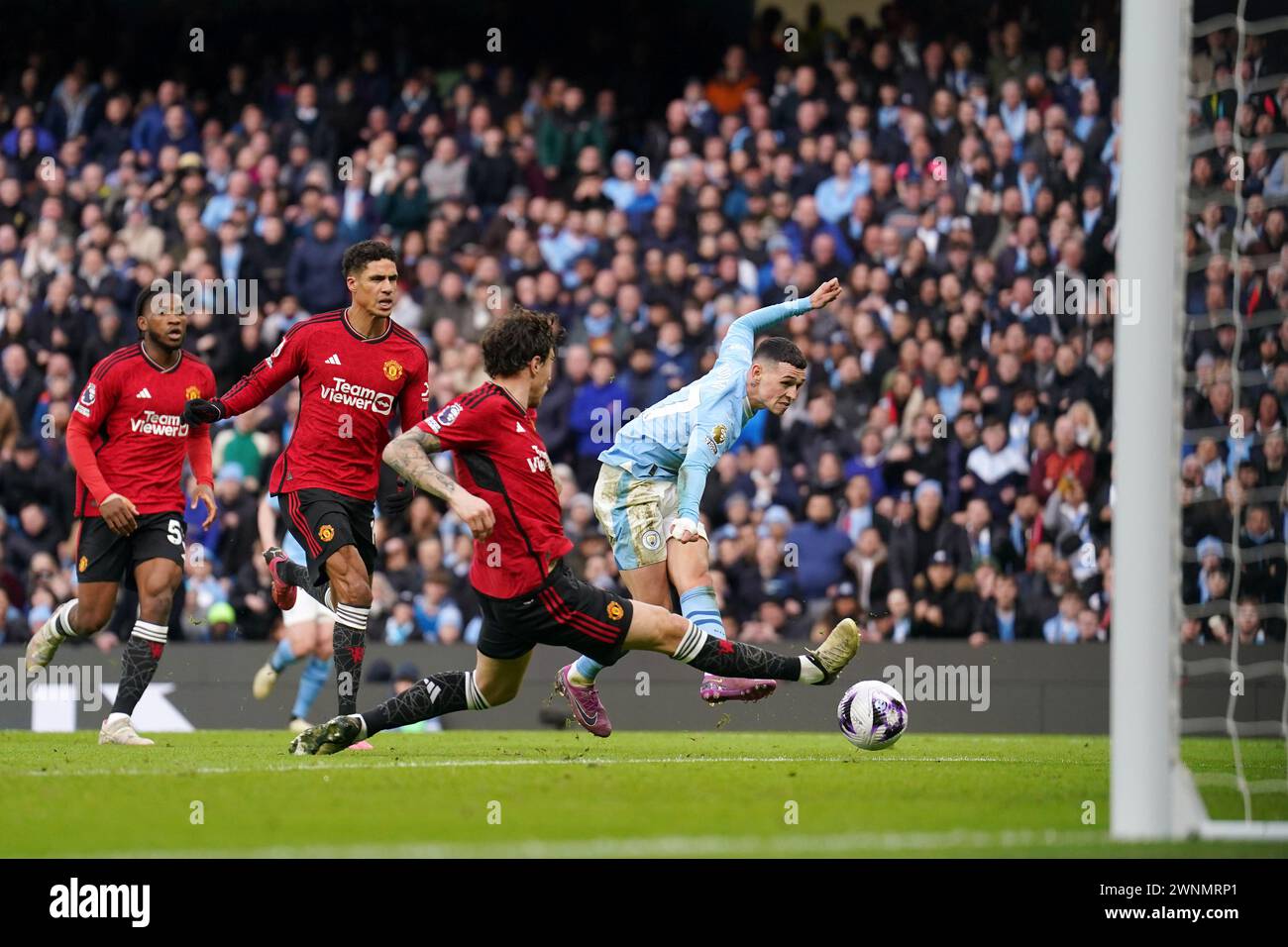 Manchester City's Phil Foden (right) scores their side's second goal of ...