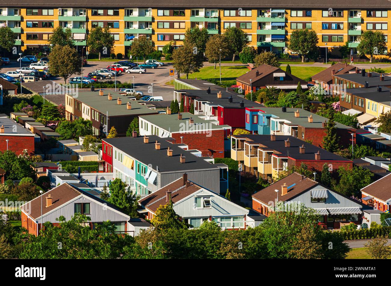 A cluster of residential houses tightly packed together in a ...