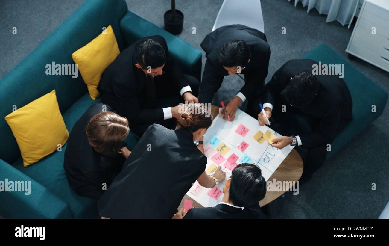 Top view of business people hands making scrum task board to manage ...