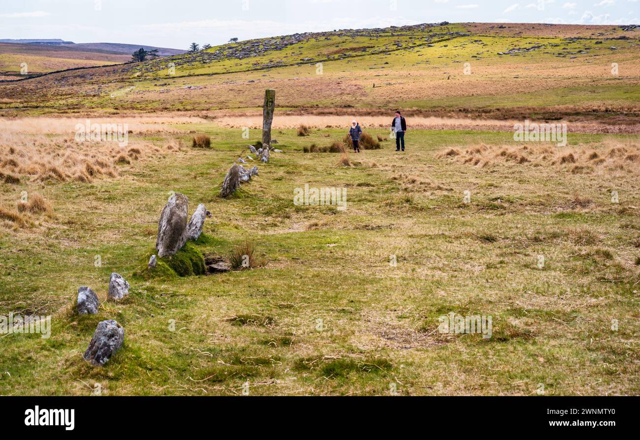 Two Walkers stop to admire the tall terminal stone of a prehistoric ...