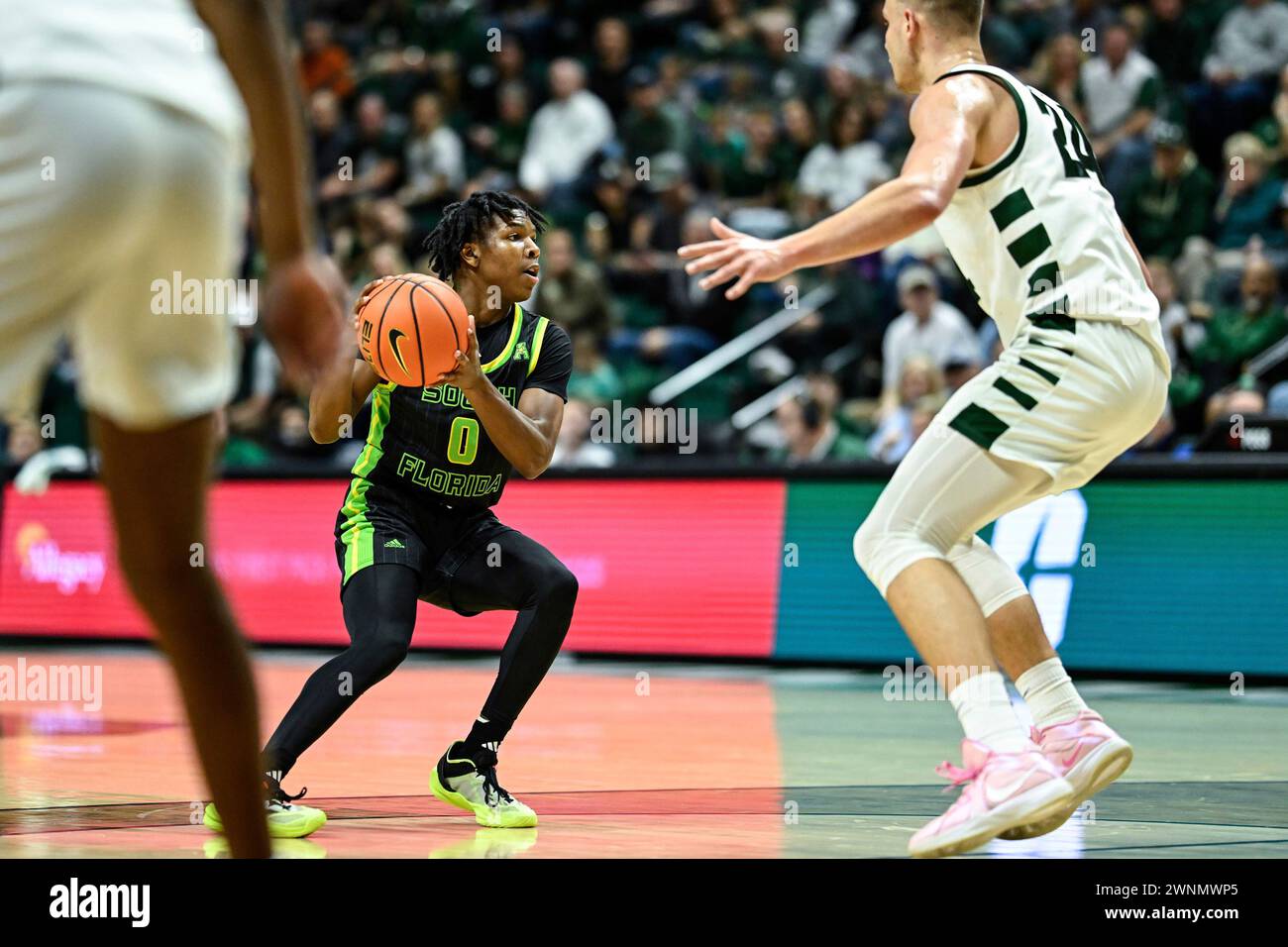 South Florida guard Jayden Reid (0) looks to pass the ball away from ...